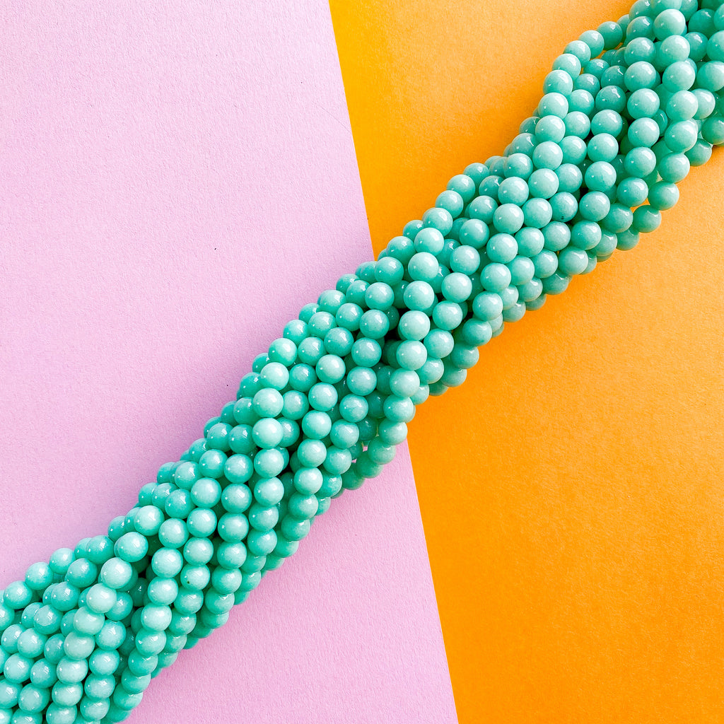 6mm Smooth Turquoise Dyed Calcite Rounds Strand – Beads, Inc.