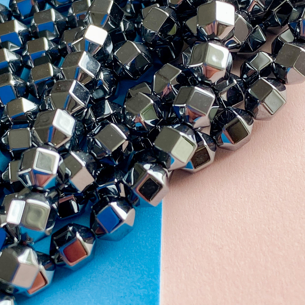 5mm Shiny Hematite Faceted Hex Barrel Strand – Beads, Inc.